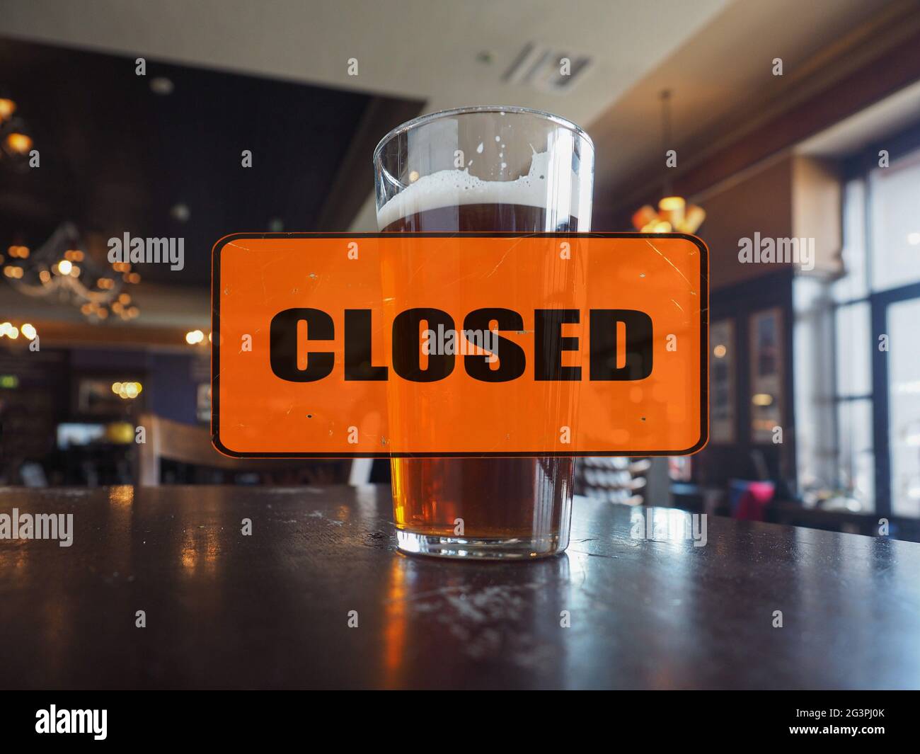 Empty pub with closed sign Stock Photo - Alamy