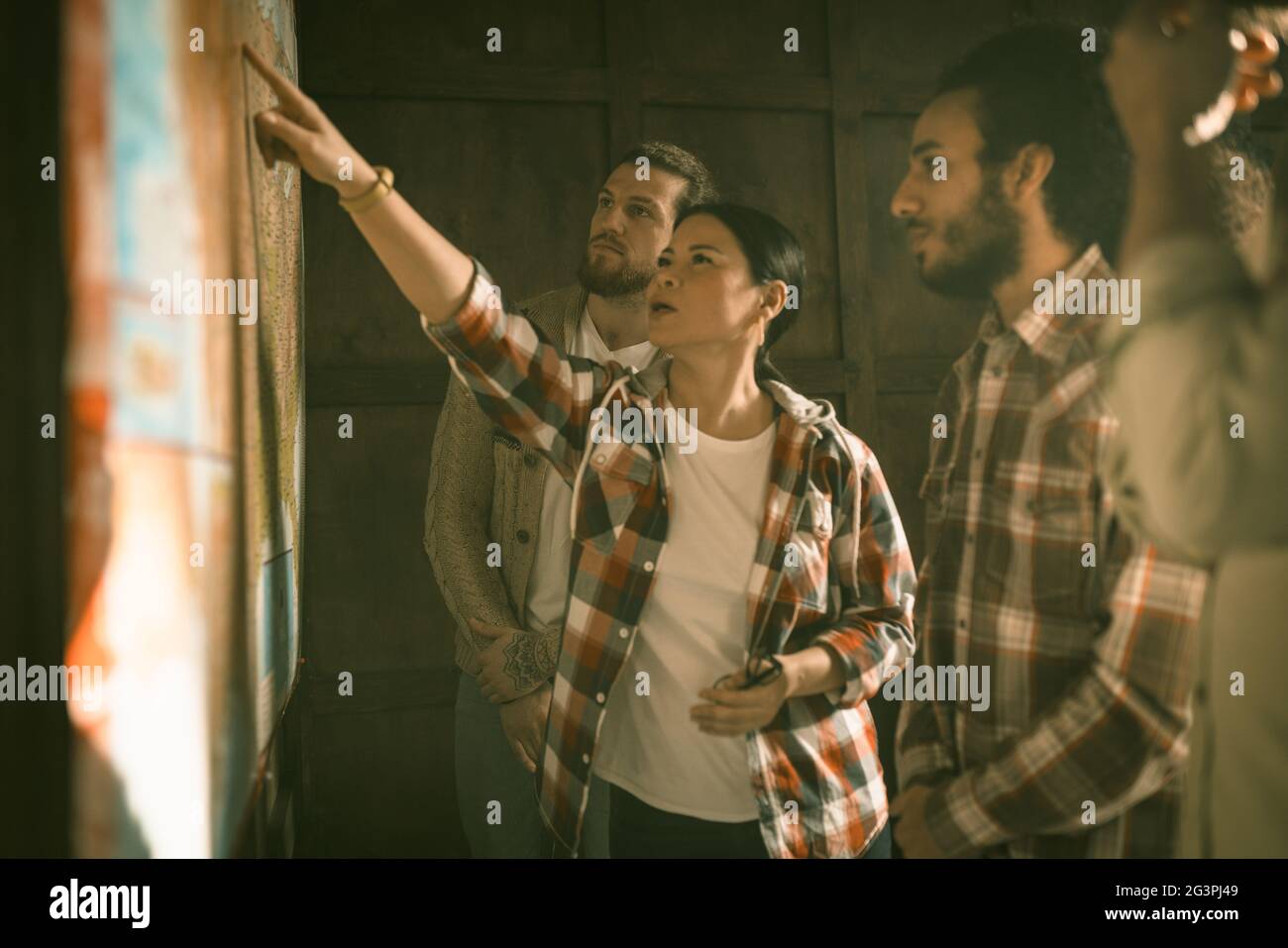 Brunette Woman Shows On Map Some Location Stock Photo - Alamy