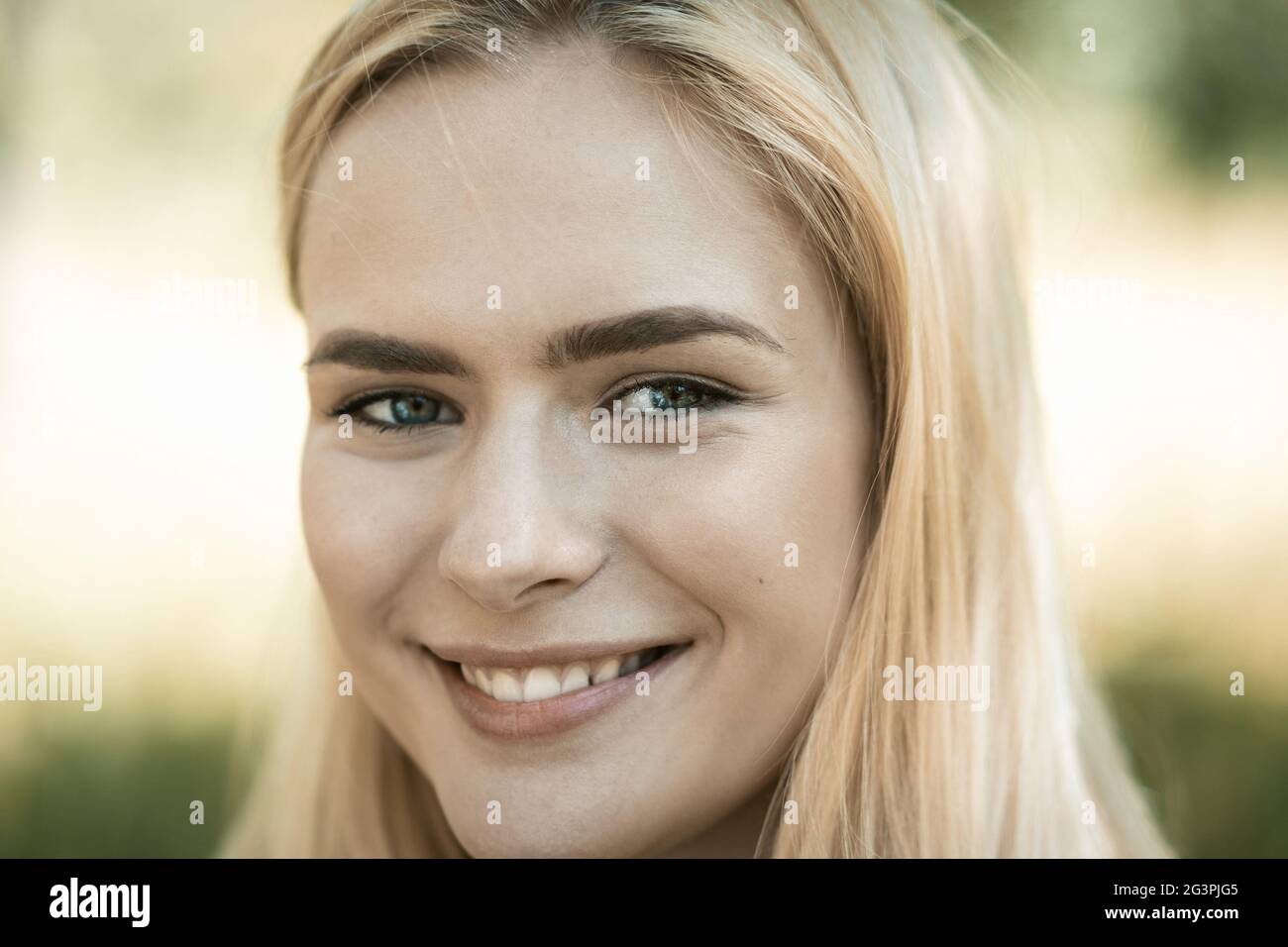 Smiling pretty Lady In Park Close Up Portrait Stock Photo - Alamy