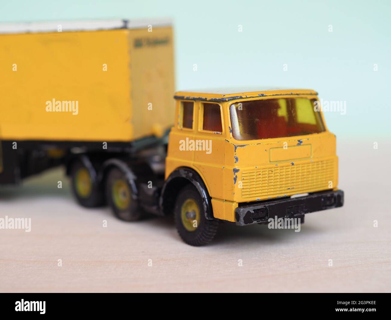 Yellow toy lorry Stock Photo - Alamy