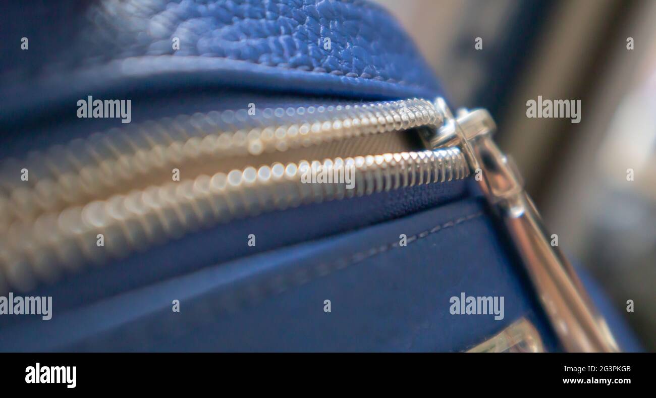Natural or artificial leather texture. Fragment of a blue bag with a ...