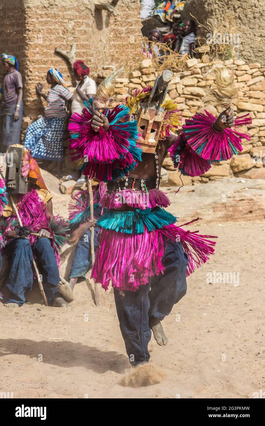 Dogon dancers performing the Dama ritual dance wearing Kanaga masks ...