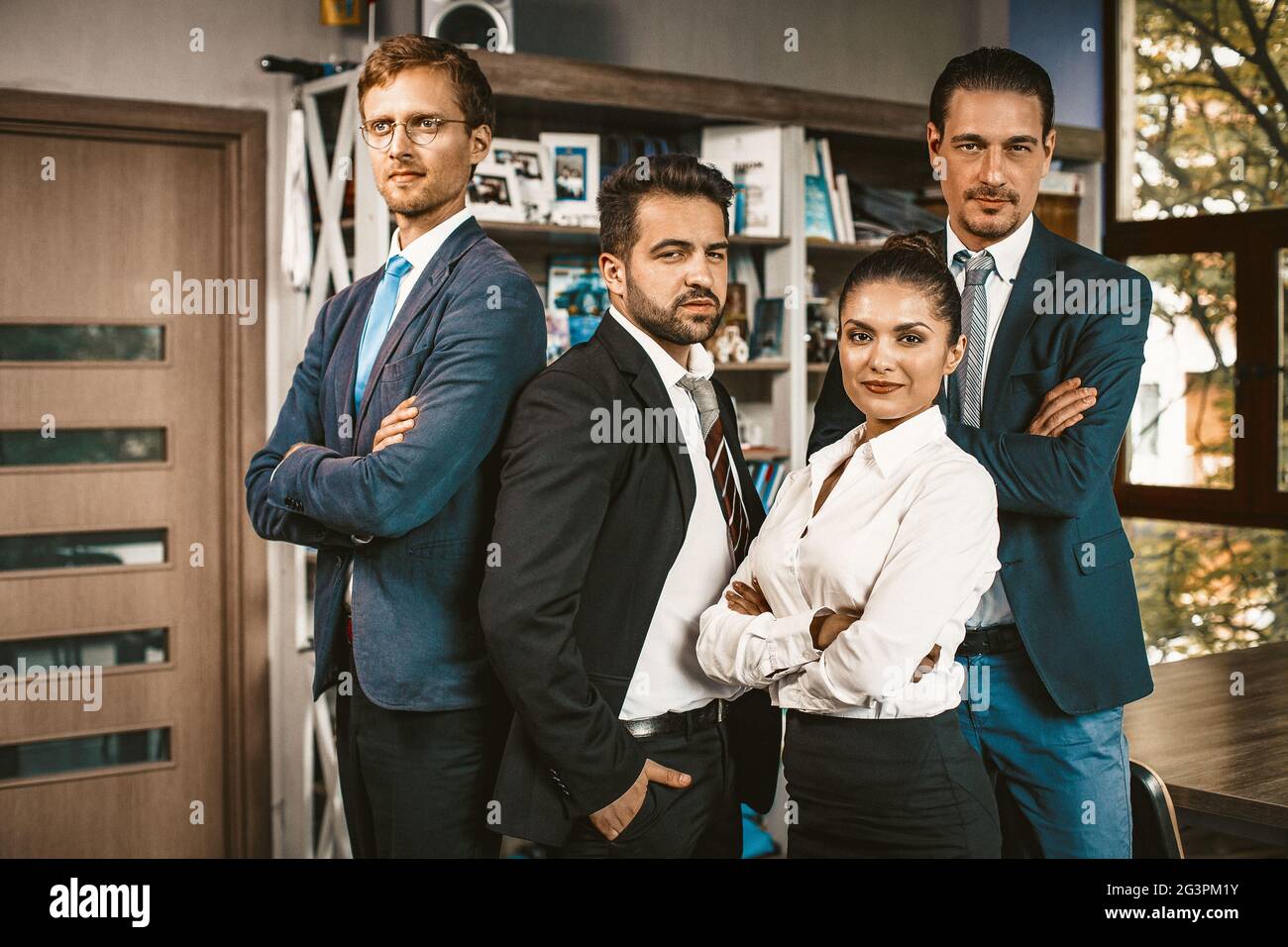 Female Boss And Her Male Business Team Stock Photo - Alamy