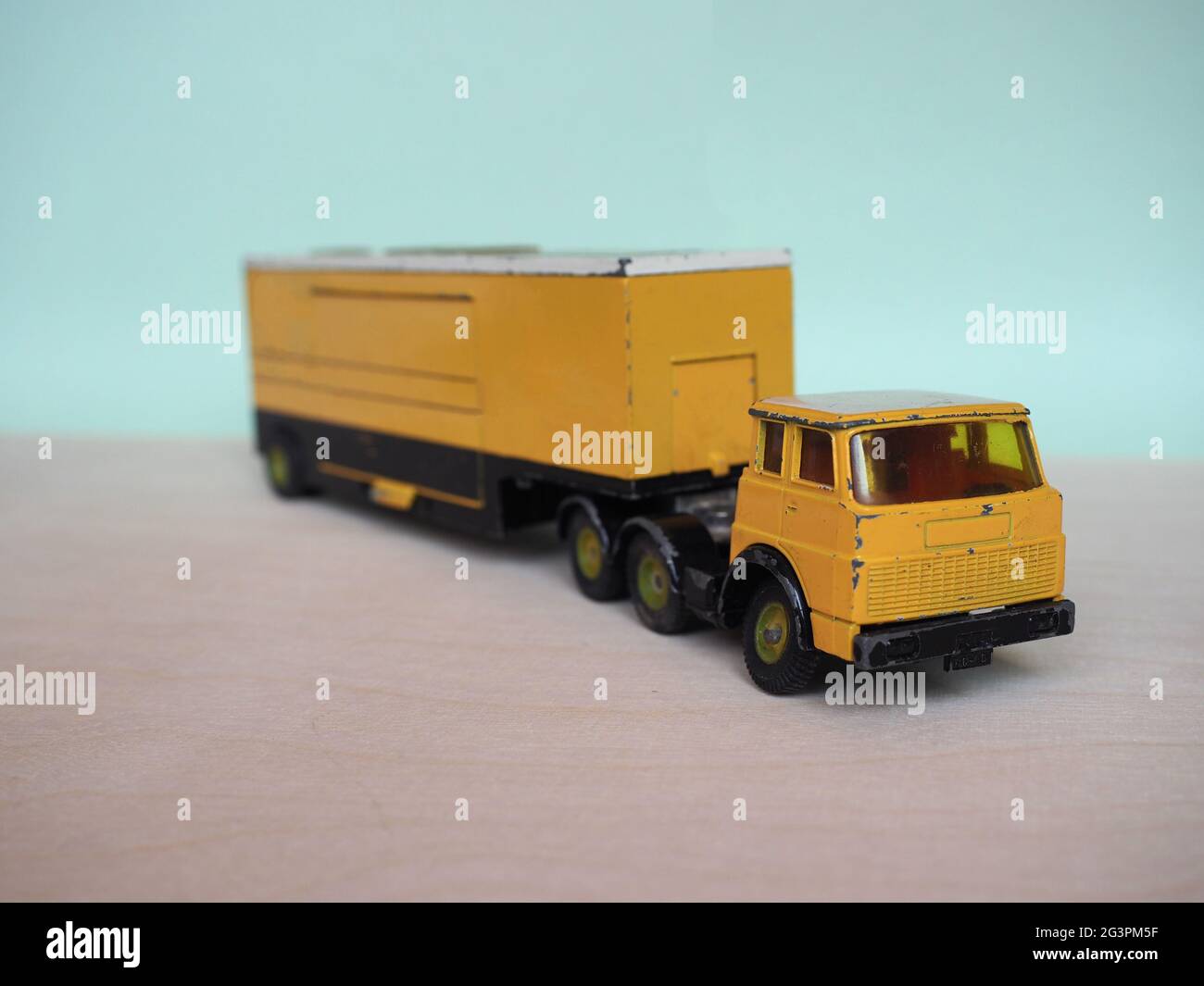 Yellow toy lorry Stock Photo - Alamy
