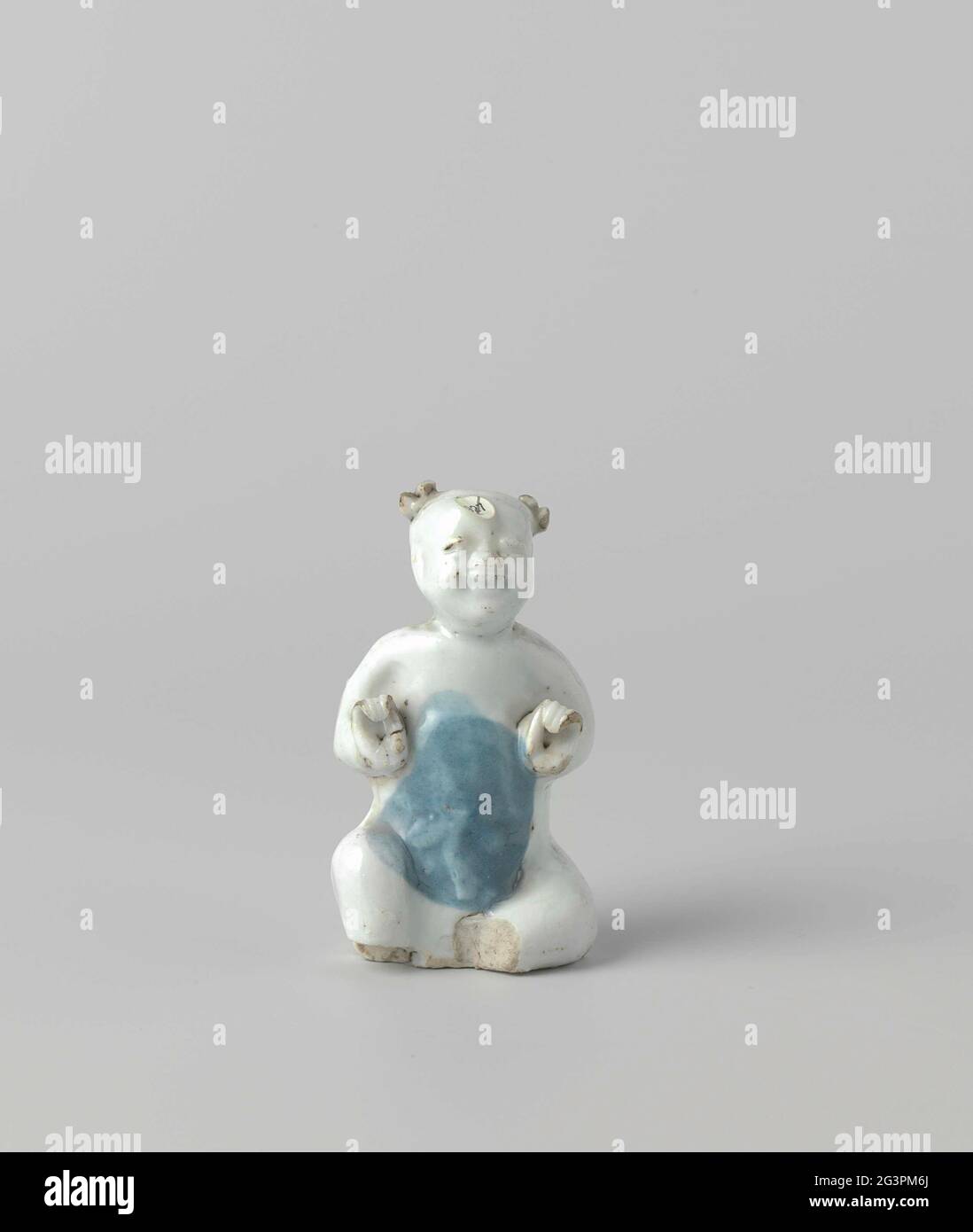 Figure of A Seated Boy. Image of porcelain in the shape of a seated boy ...