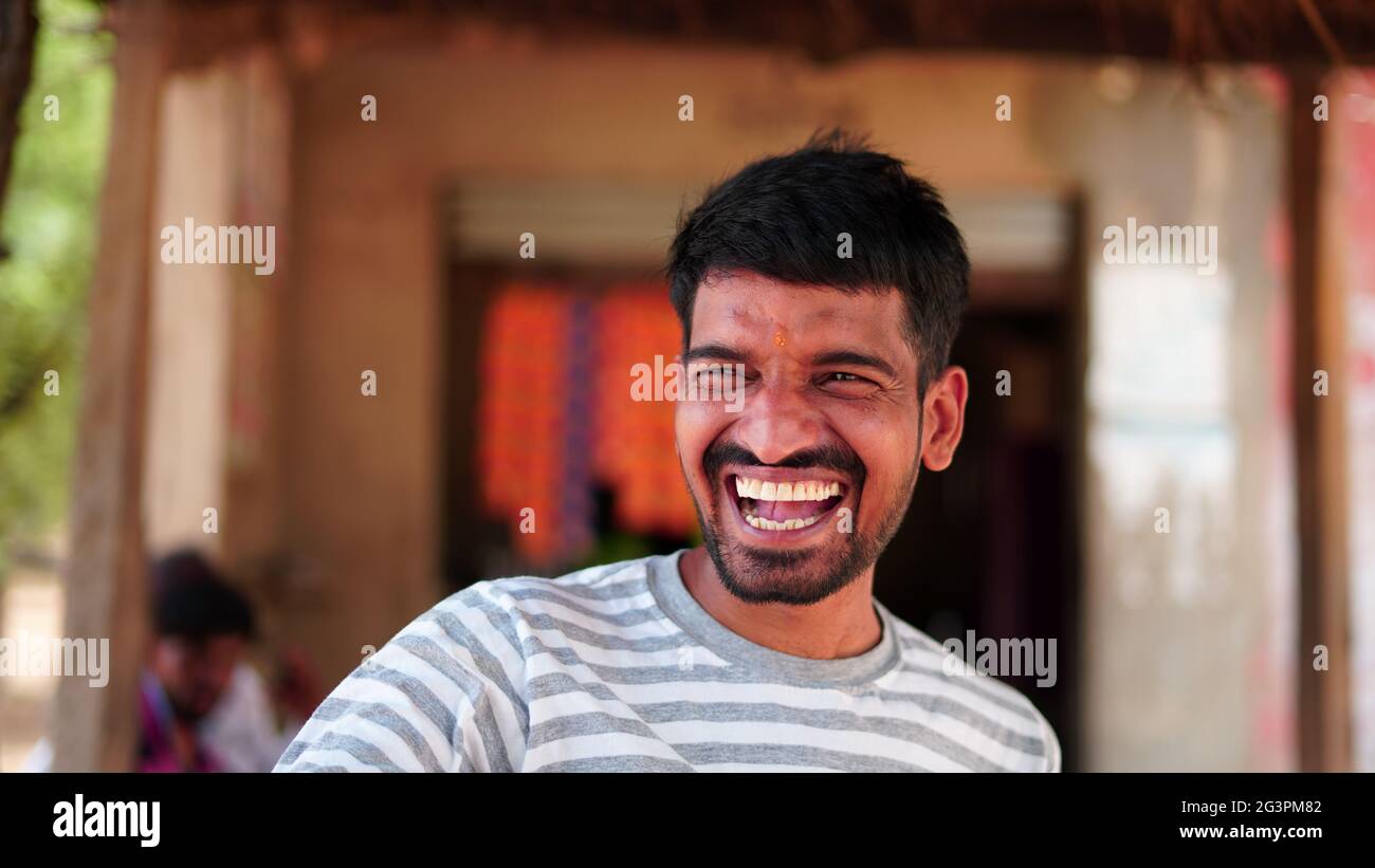 Close Up Shot Of A Satisfied Indian Young Man Celebrating Success