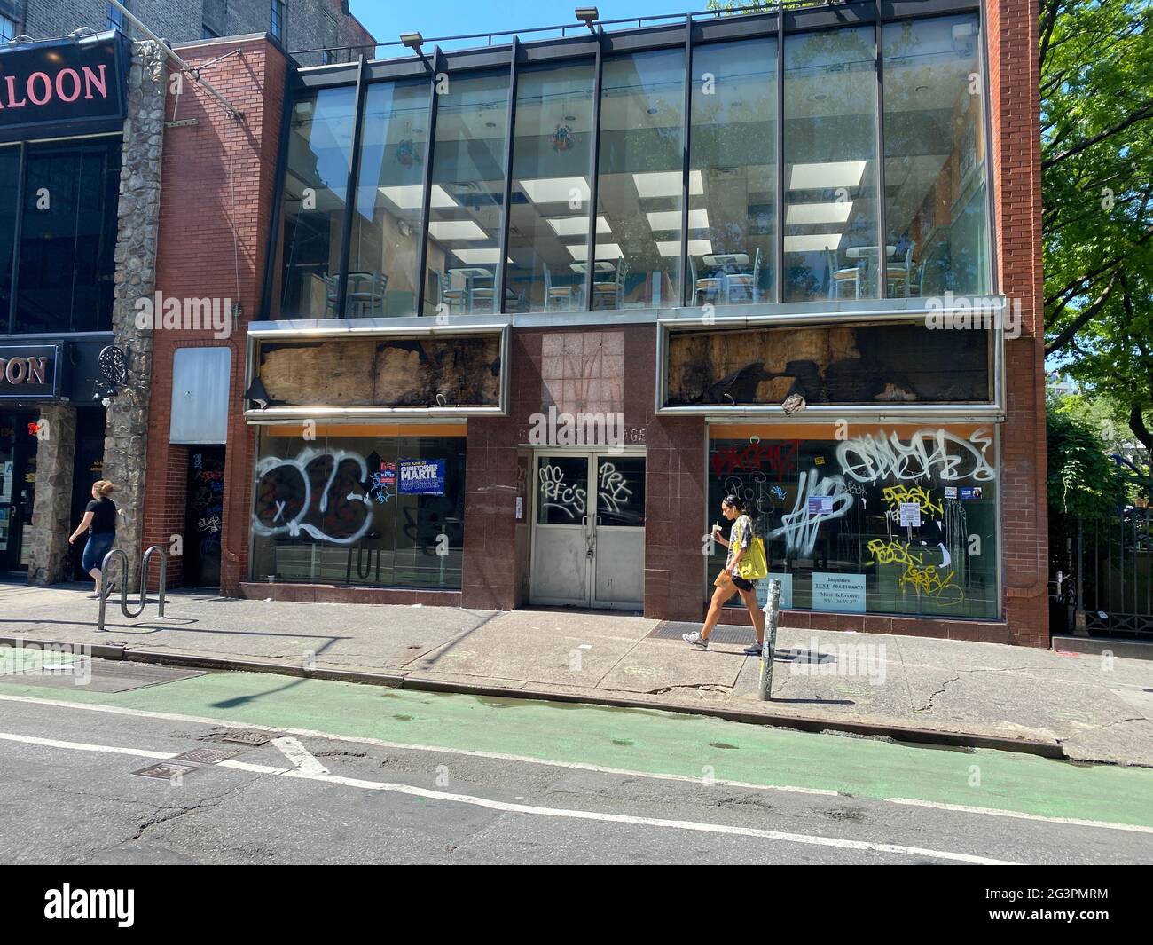 Closed storefront with graffiti, a casualty of the Covid-19 pandemick ...