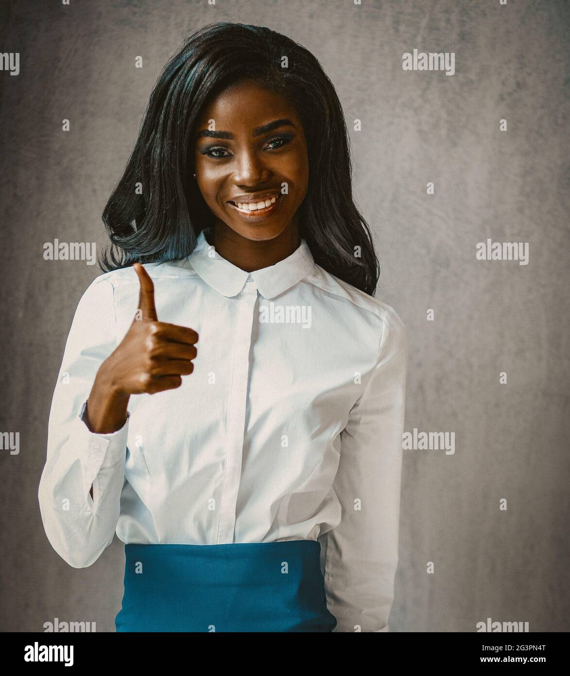 Smiling African Women shows Big Thumb In Approval Stock Photo - Alamy