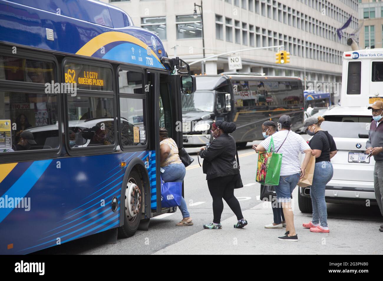 People wait at a bus stop in downtown Brooklyn, New York Stock Photo ...