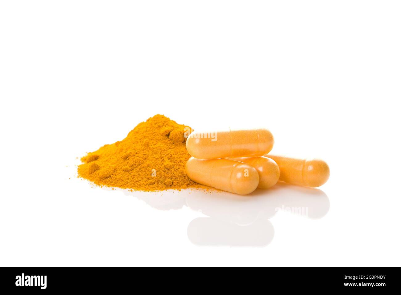 Turmeric powder and yellow capsules on white background Stock Photo - Alamy