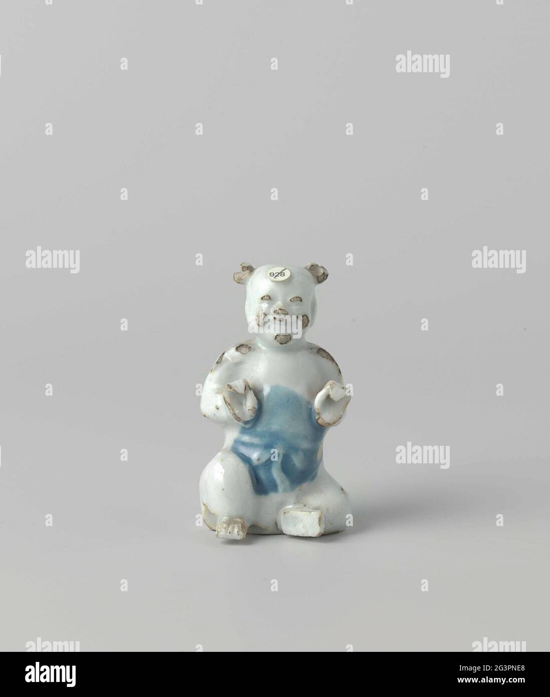 Figure of A Seated Boy. Image of porcelain in the shape of a seated boy ...