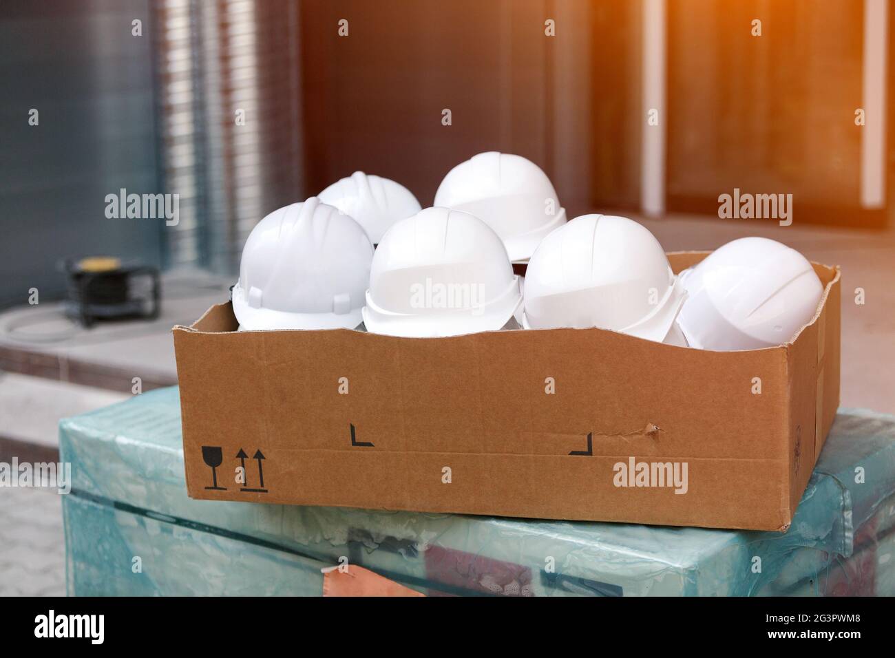New safety helmets in a box Stock Photo - Alamy