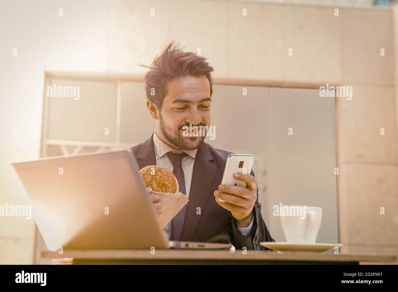 Business man eating snack walking hi-res stock photography and images ...