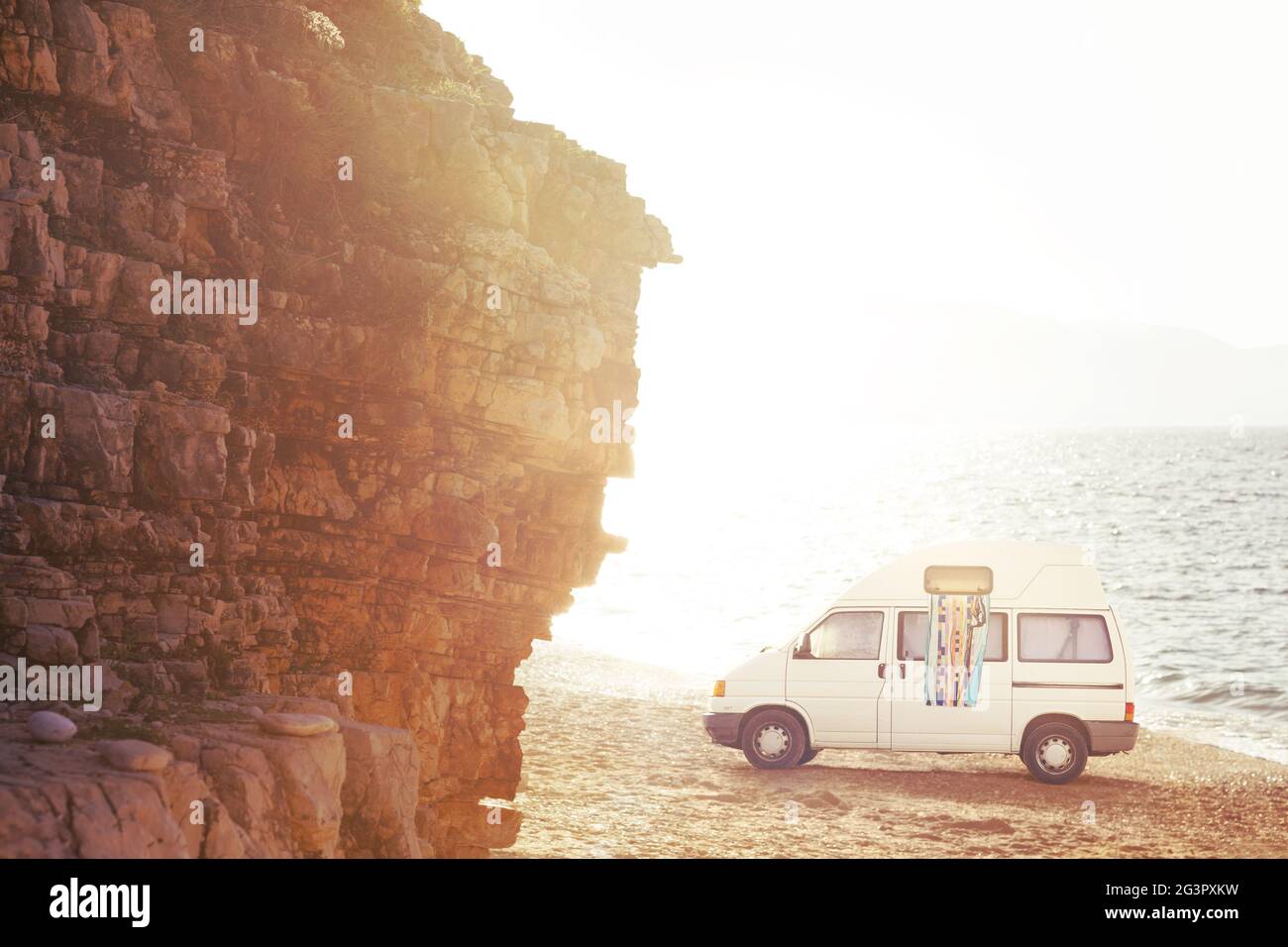 Caravan parked on beach at sunset Stock Photo - Alamy