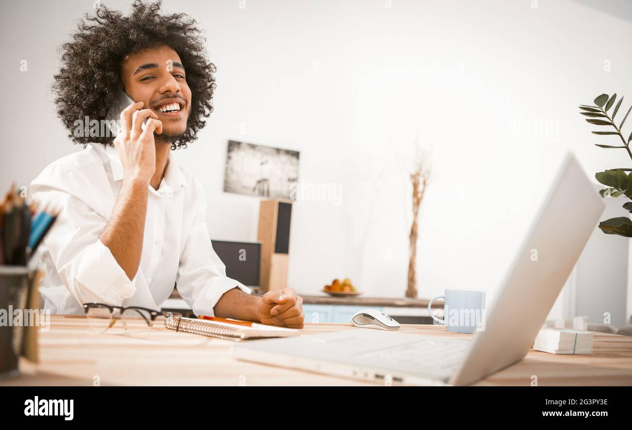 Happy Arabic man talks on mobile phone toothy smiling. Creative ...