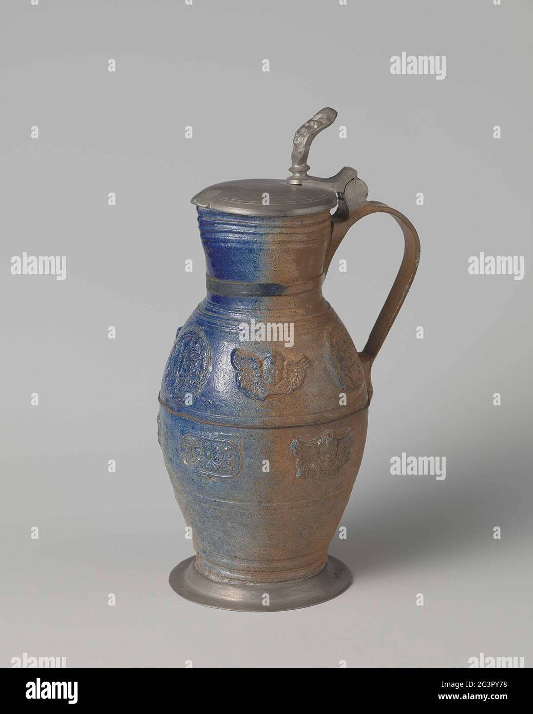 Jug. Egg-shaped jug of stoneware with a pewter lid and foot edge. The ...
