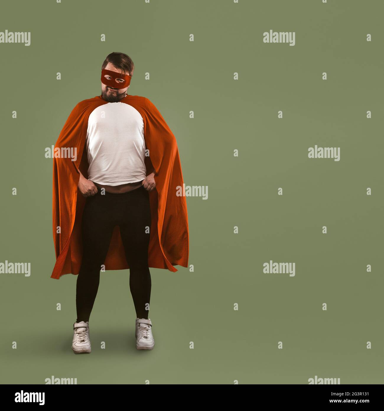 Young man stands on green hi-res stock photography and images - Alamy