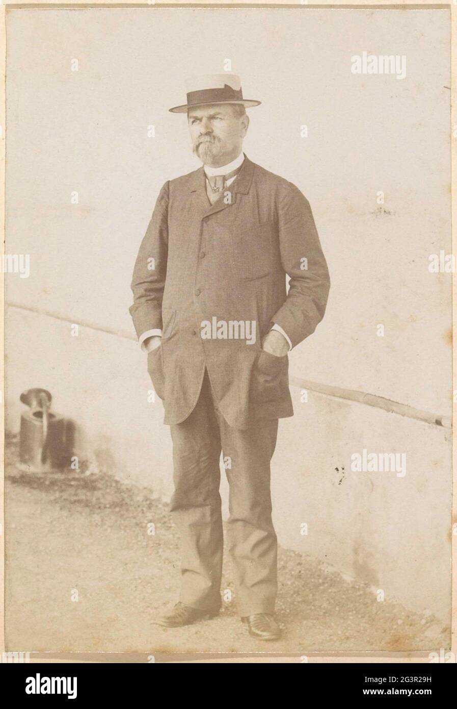 Portrait of a French man standing with both hands in the bags. Part of ...