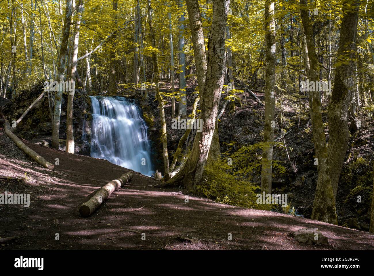 Silverfallet Staircase Waterfall illuminated by low rays of the sun ...