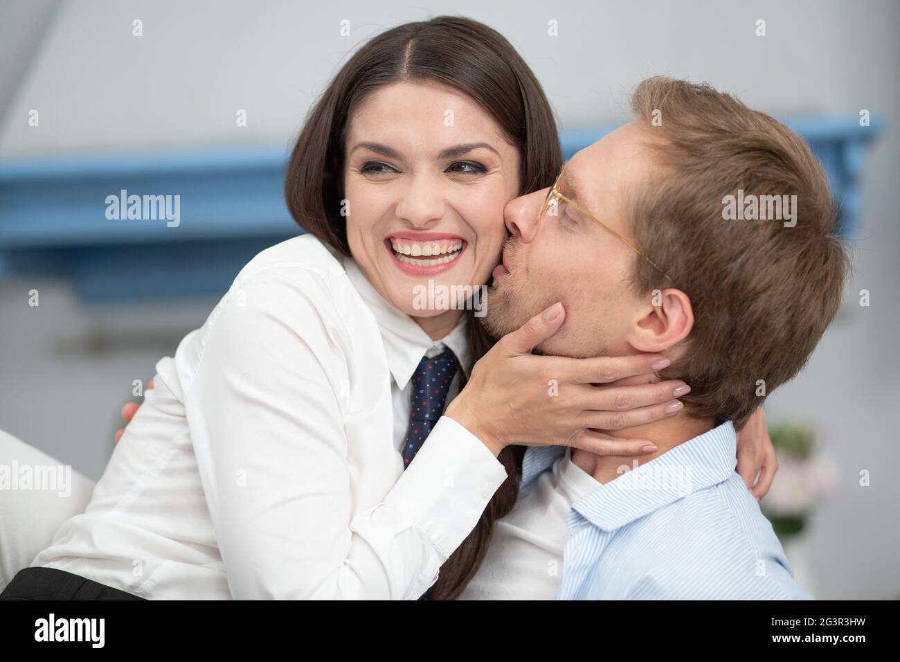Pretty young couple kissing bed hi-res stock photography and images - Alamy