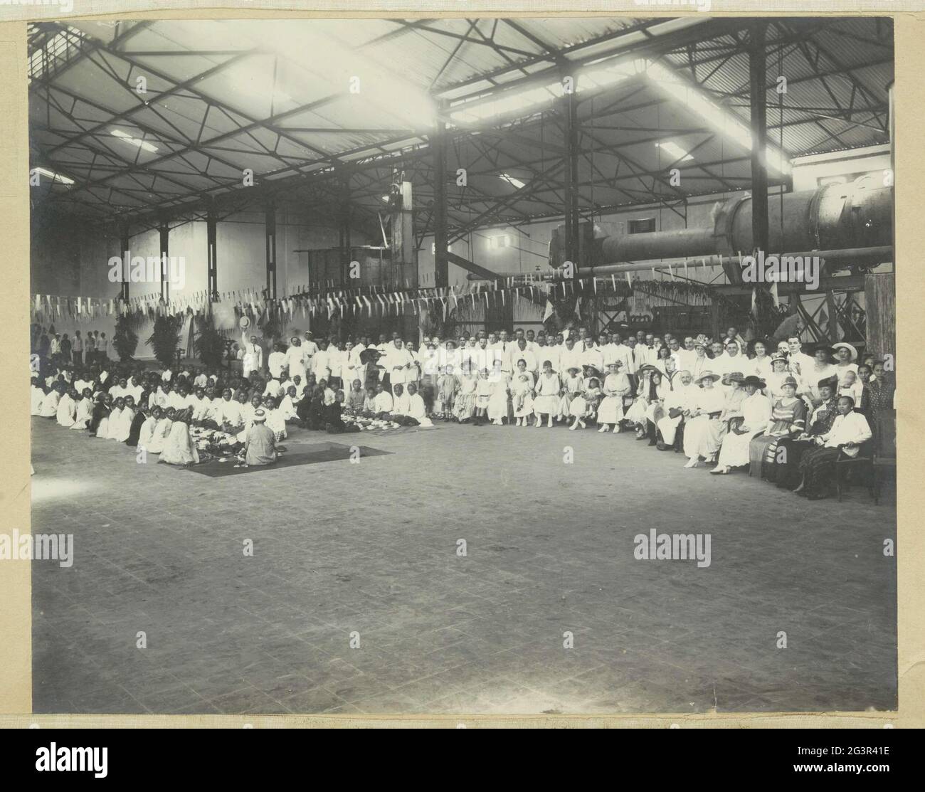 Group portrait of Indian and European people at a festive occasion in a ...