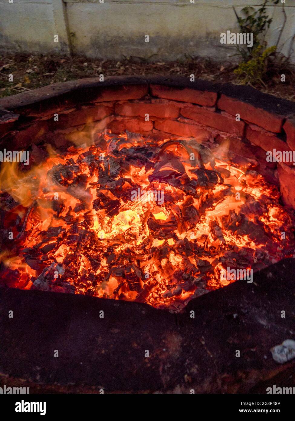 Glowing Fire embers in hot red color, abstract background. The hot ...