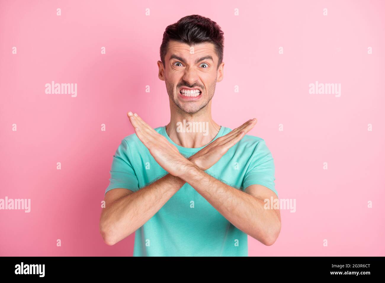 Photo of young unhappy angry aggressive displeased stressed man showing ...