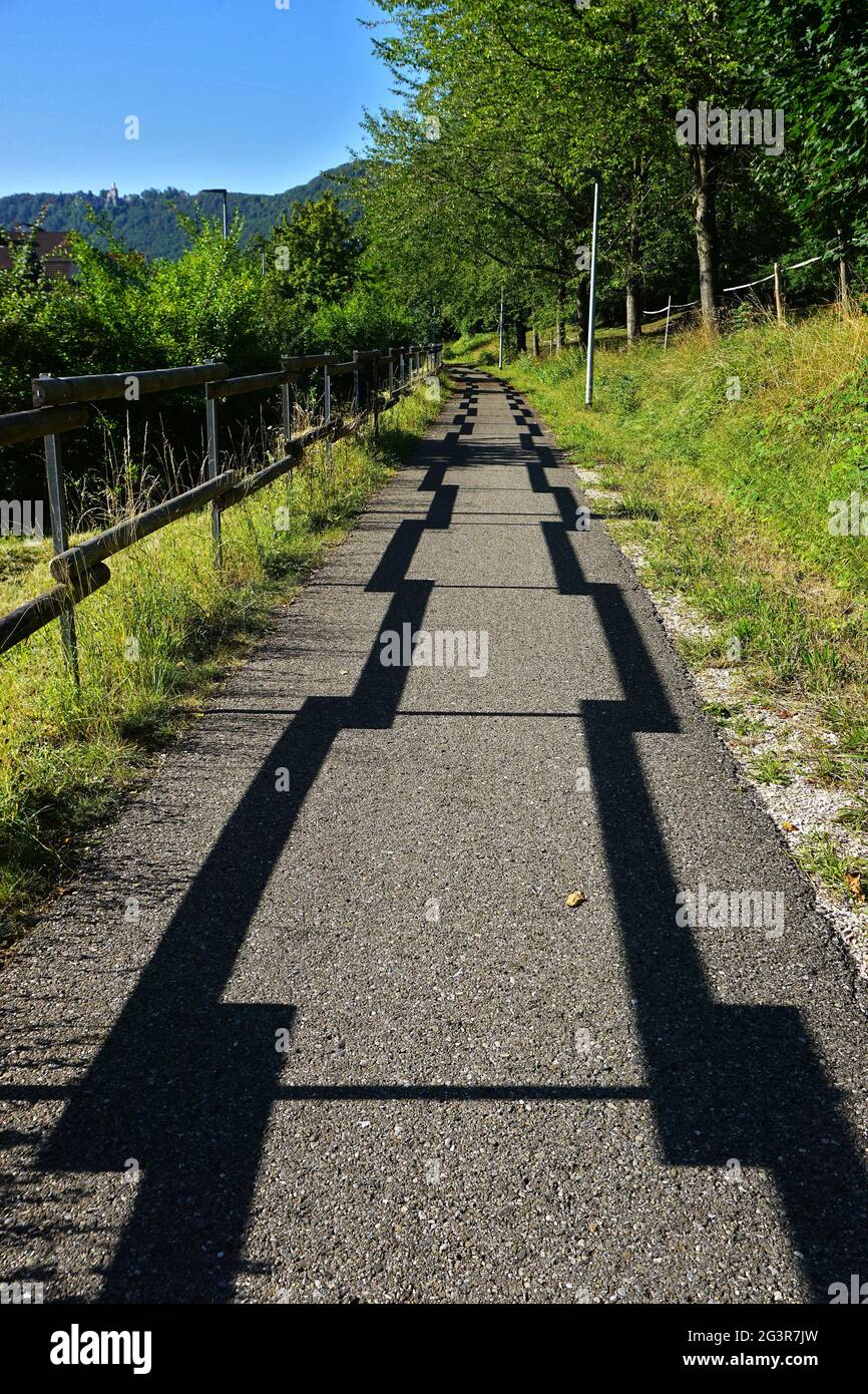 Shadow on a bicycle path Stock Photo - Alamy