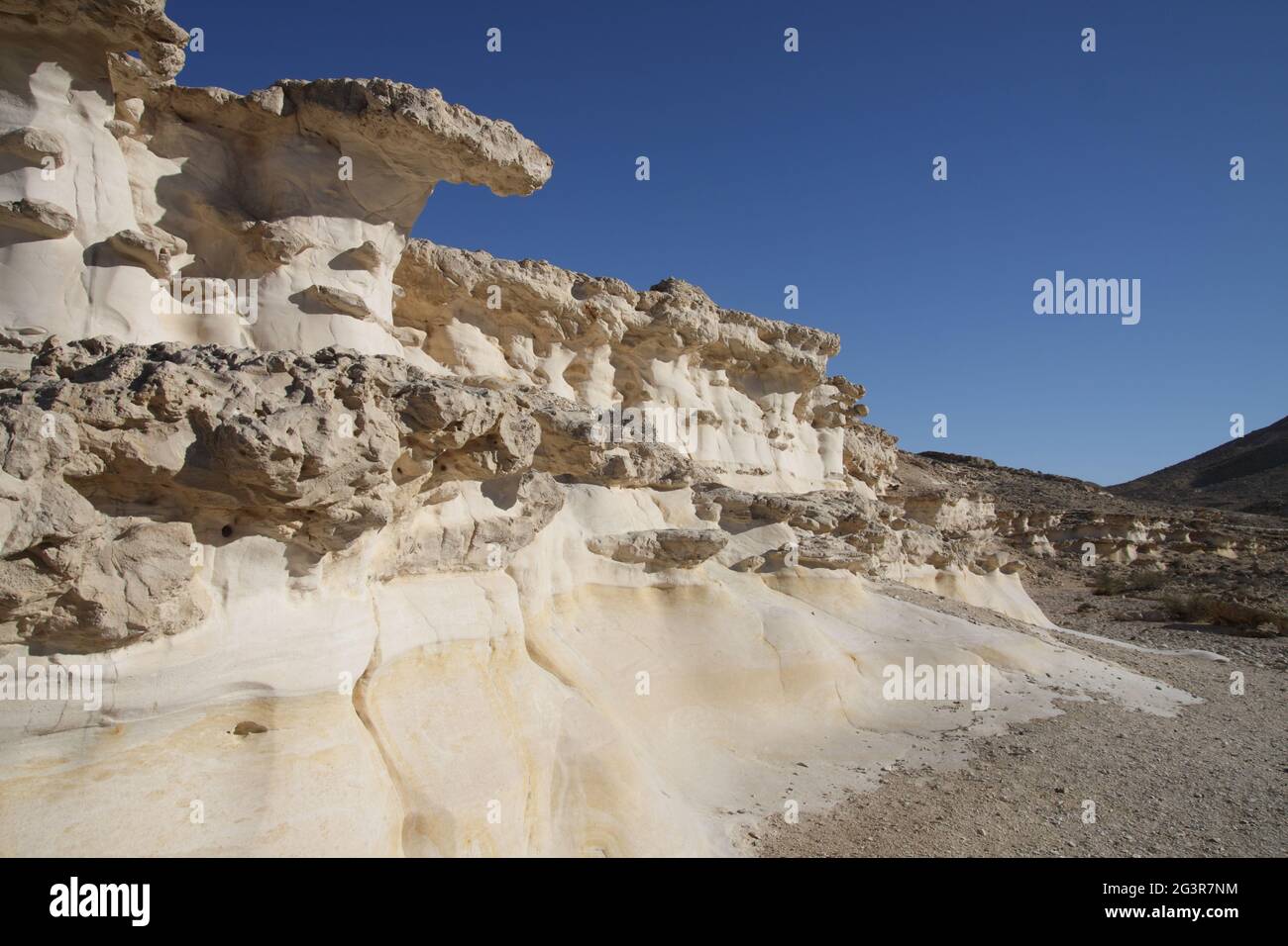 Cliff with smooth soft white Limestone parts shaped by erosion and ...
