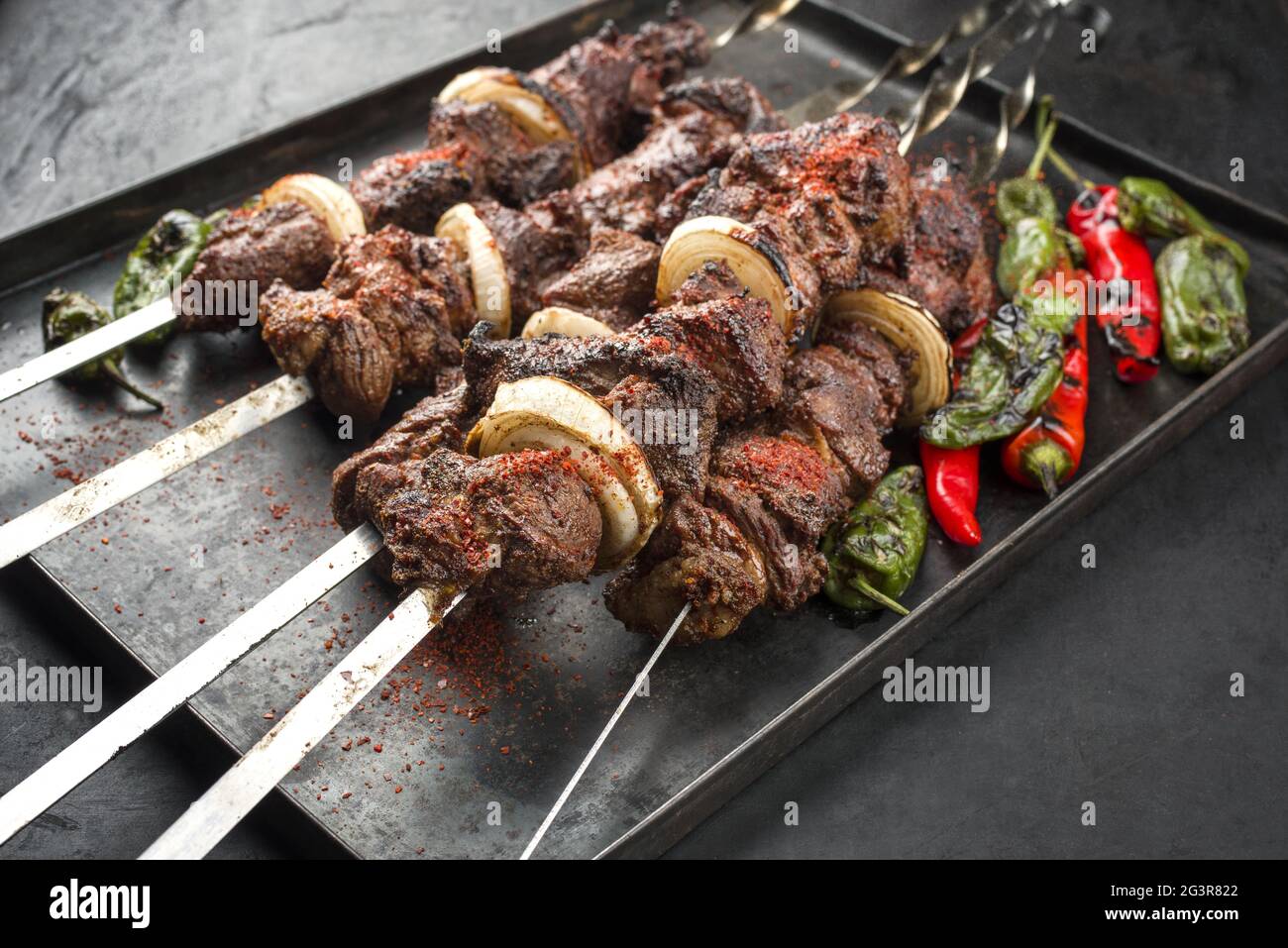 Traditional Russian lamb shashlik on a barbecue skewer with chili Stock ...