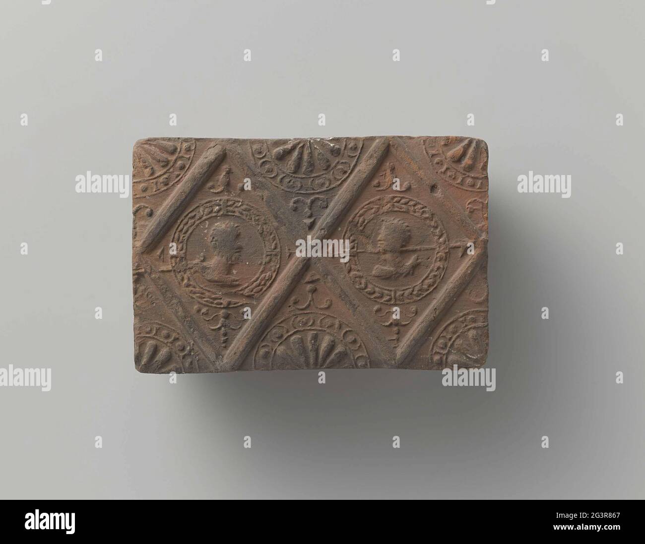 Fireplace of baked earth with diamond-shaped distribution, with two ...