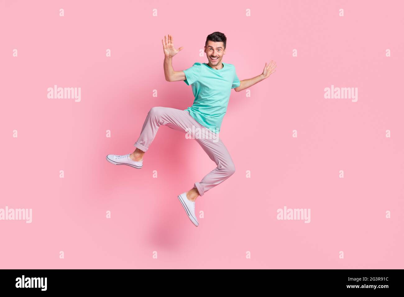 Full body photo of young man happy positive smile have fun jump up ...