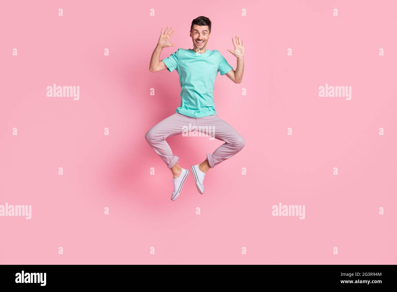 Photo of young cheerful man happy smile excited jump up wave hello ...