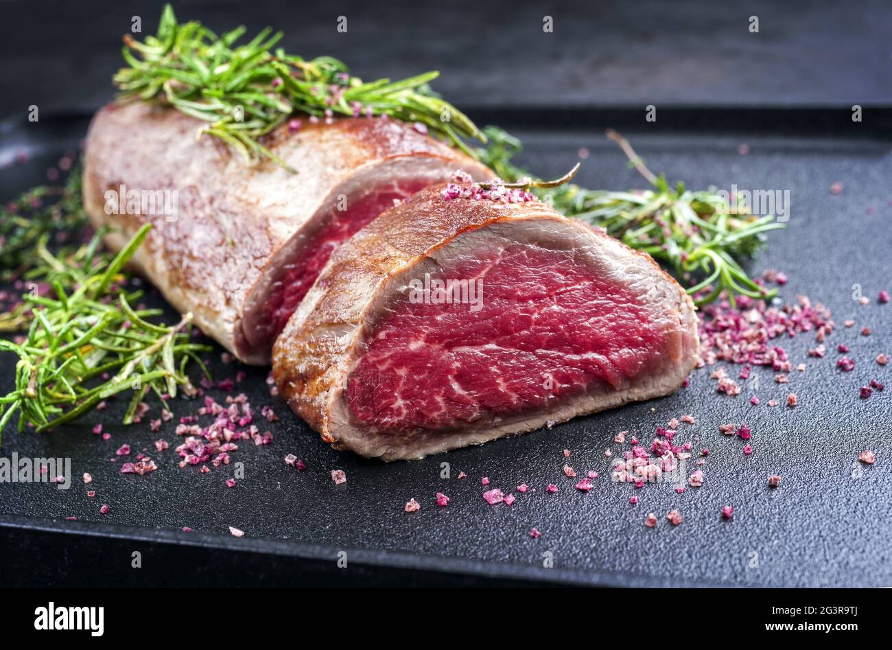 Fried dry aged beef fillet steak natural with herb and red wine salt ...