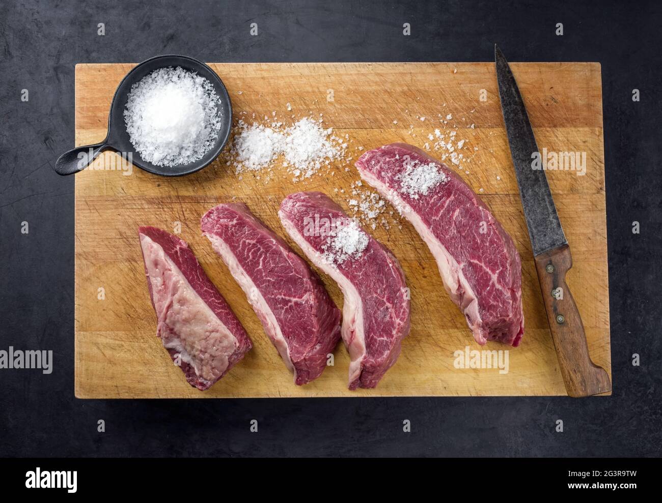 Raw dry aged wagyu cap of rump beef sliced for picanha barbecue skewer ...