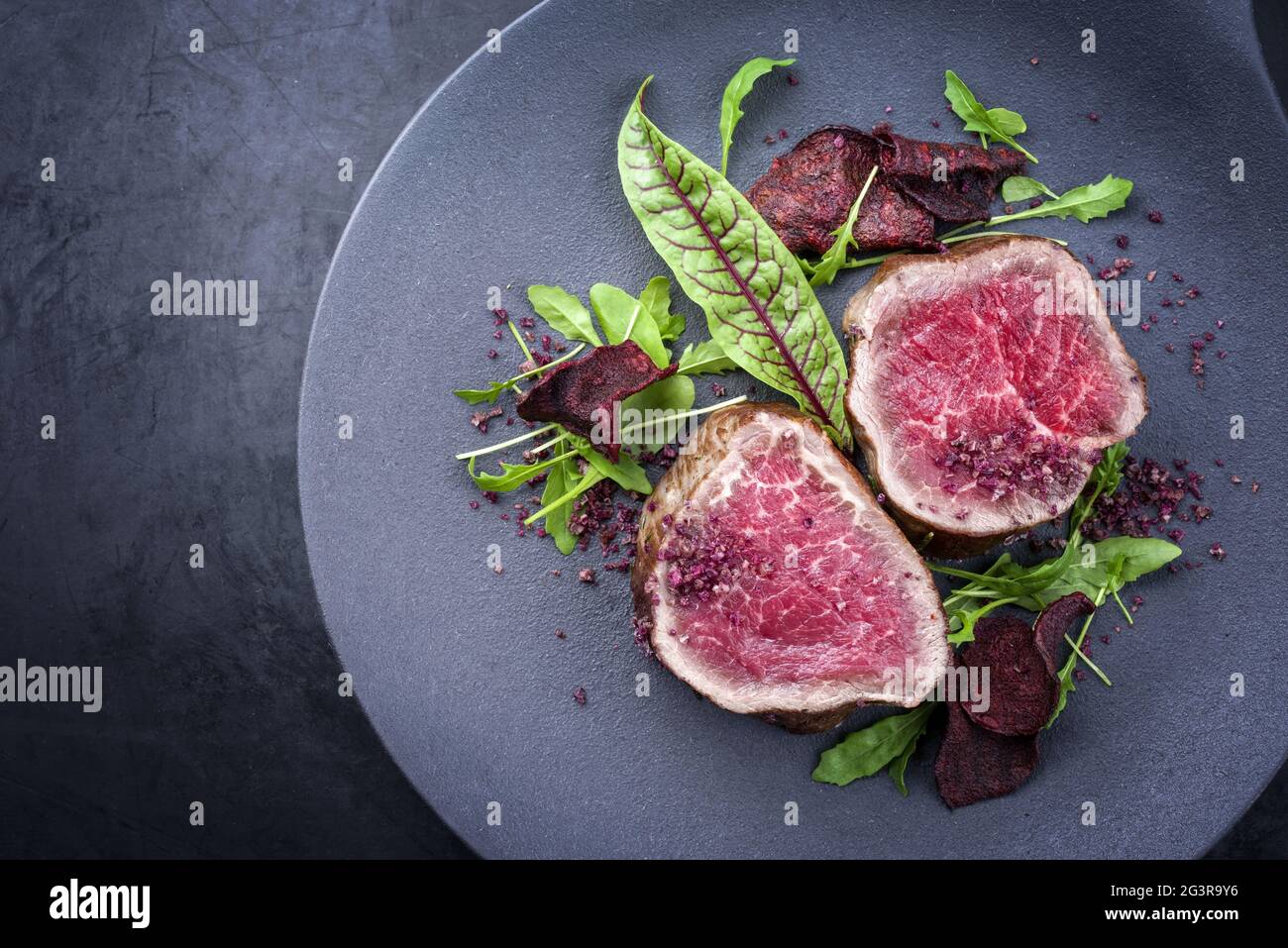 Fried dry aged beef fillet steak natural with vegetable fries and ...