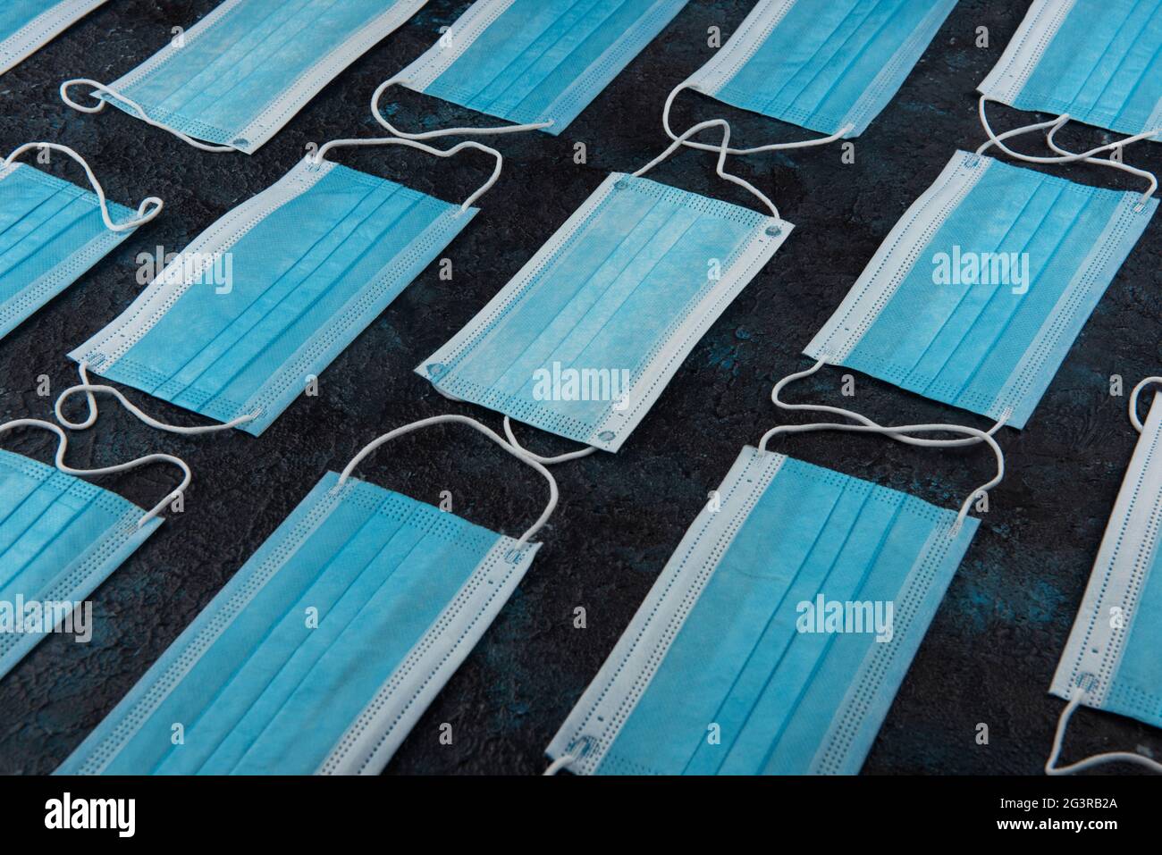 Medical masks on the blue colored background Stock Photo - Alamy