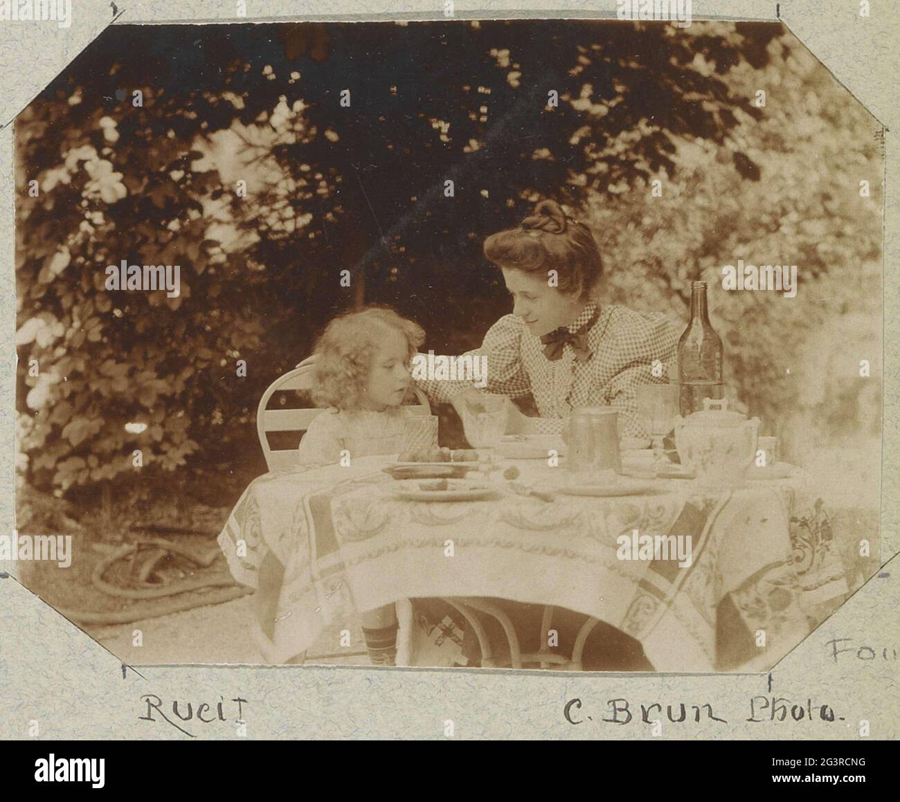 Portrait of a French mother and daughter in a garden in Rueil. Part of ...