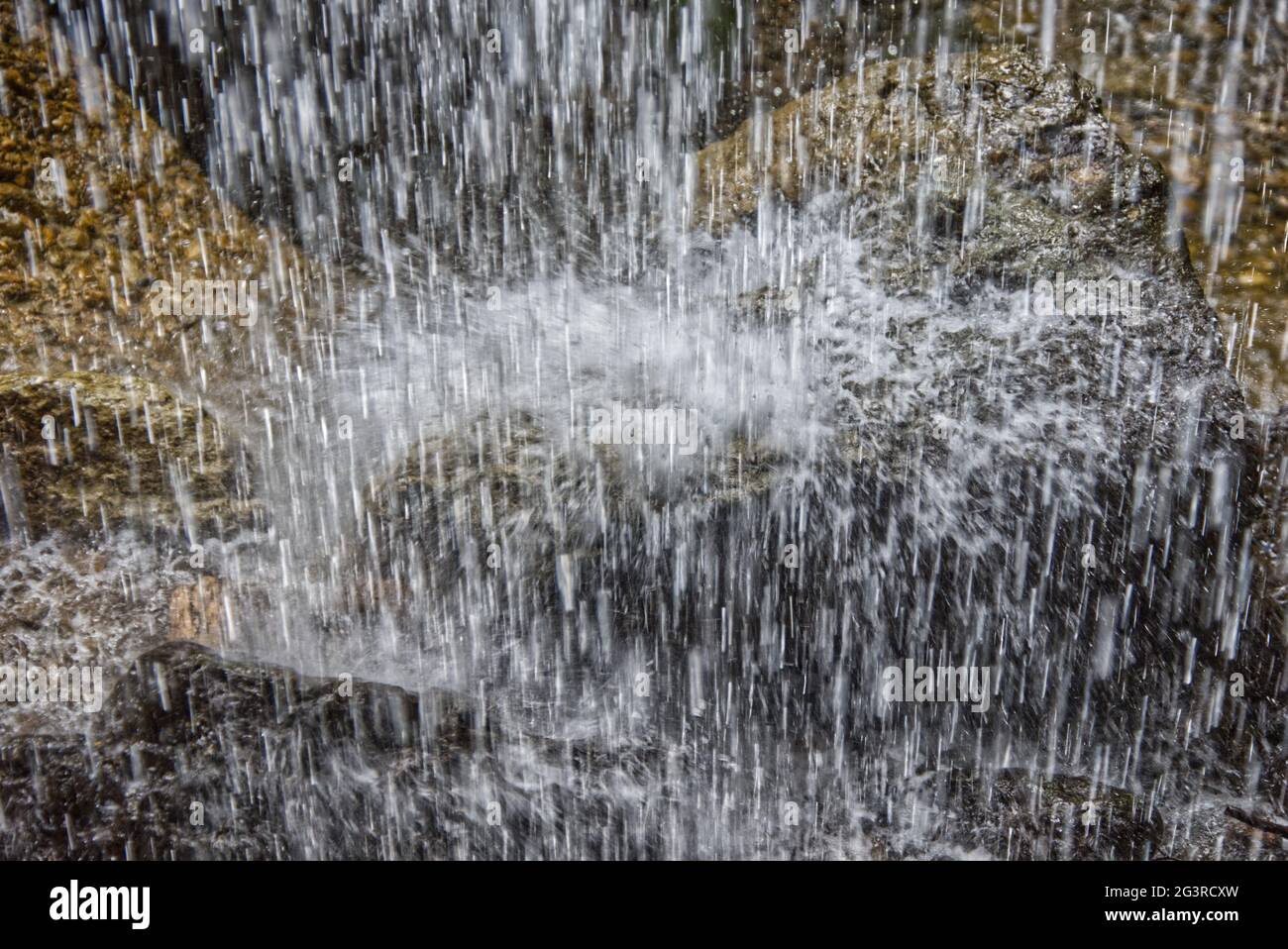 Closeup shot of a water drops of the waterfall in Moggers, Austria ...