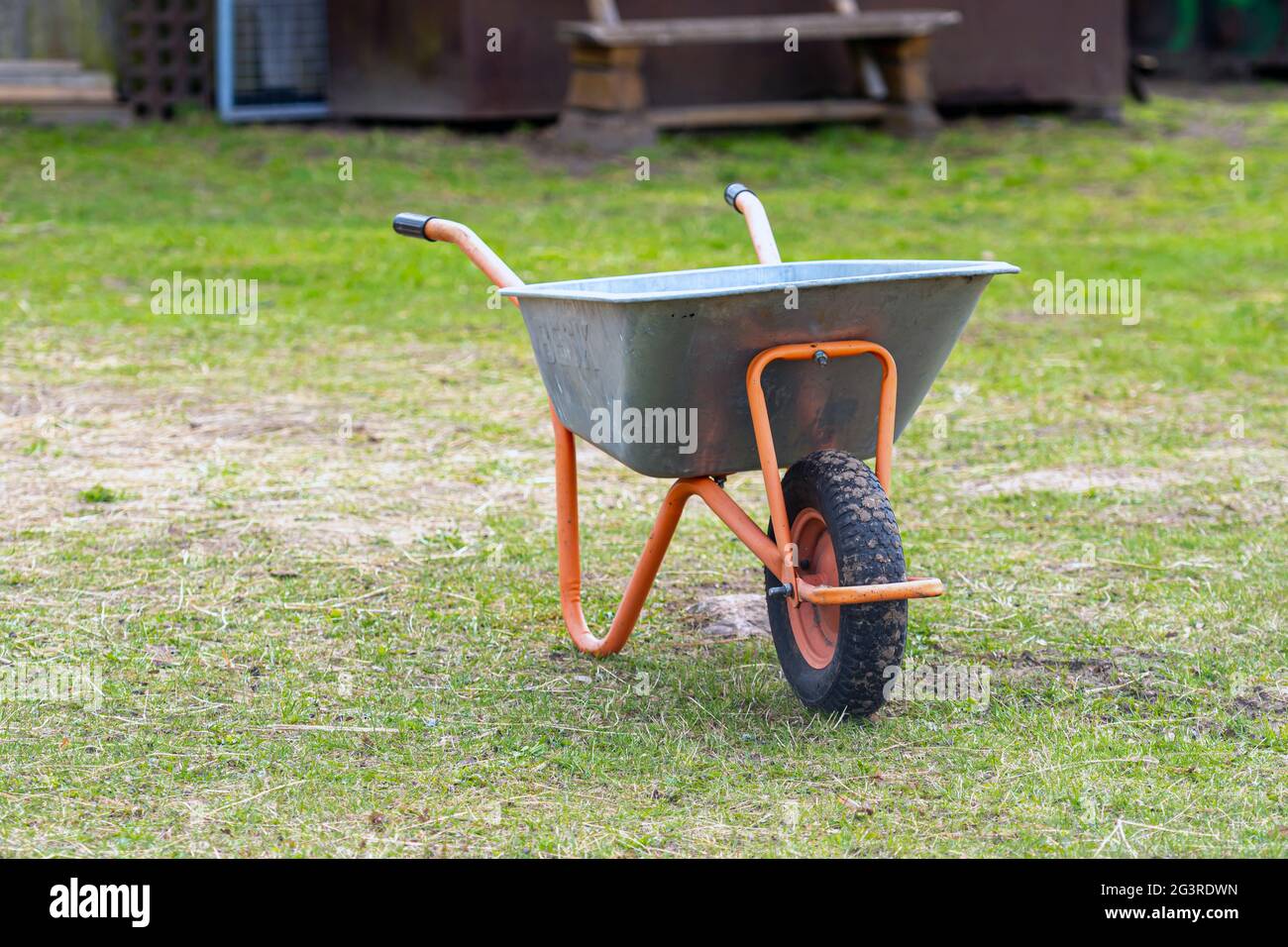 Empty Wheelbarrow In A Garden High Resolution Stock Photography and ...