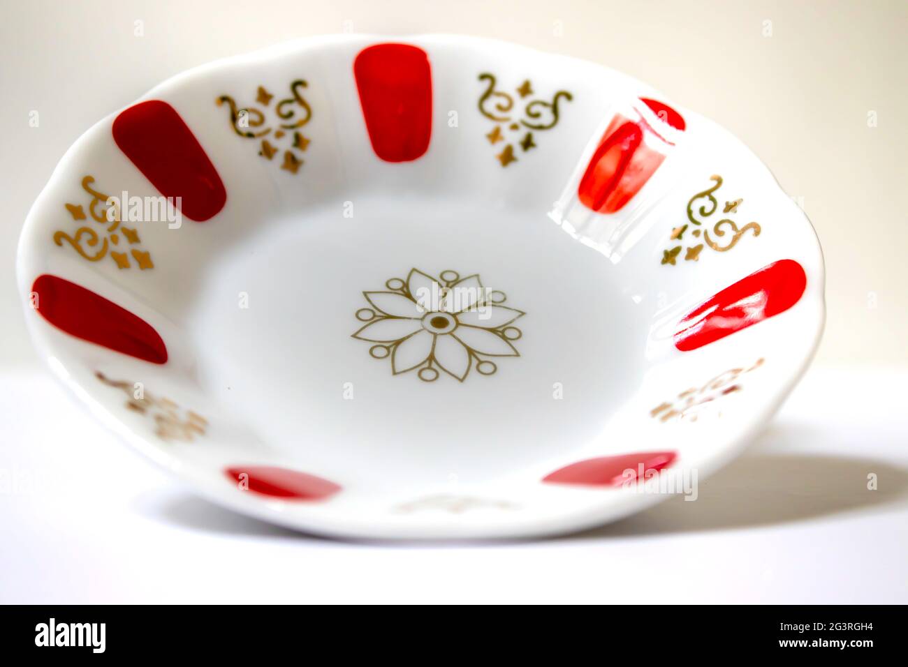 Close-up tea plate on white background. A must for tea glasses; Persian ...