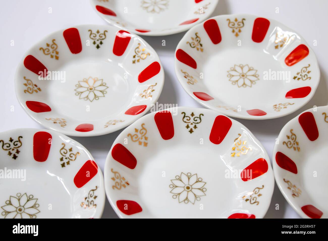 Close-up tea plate on white background. A must for tea glasses; Persian ...