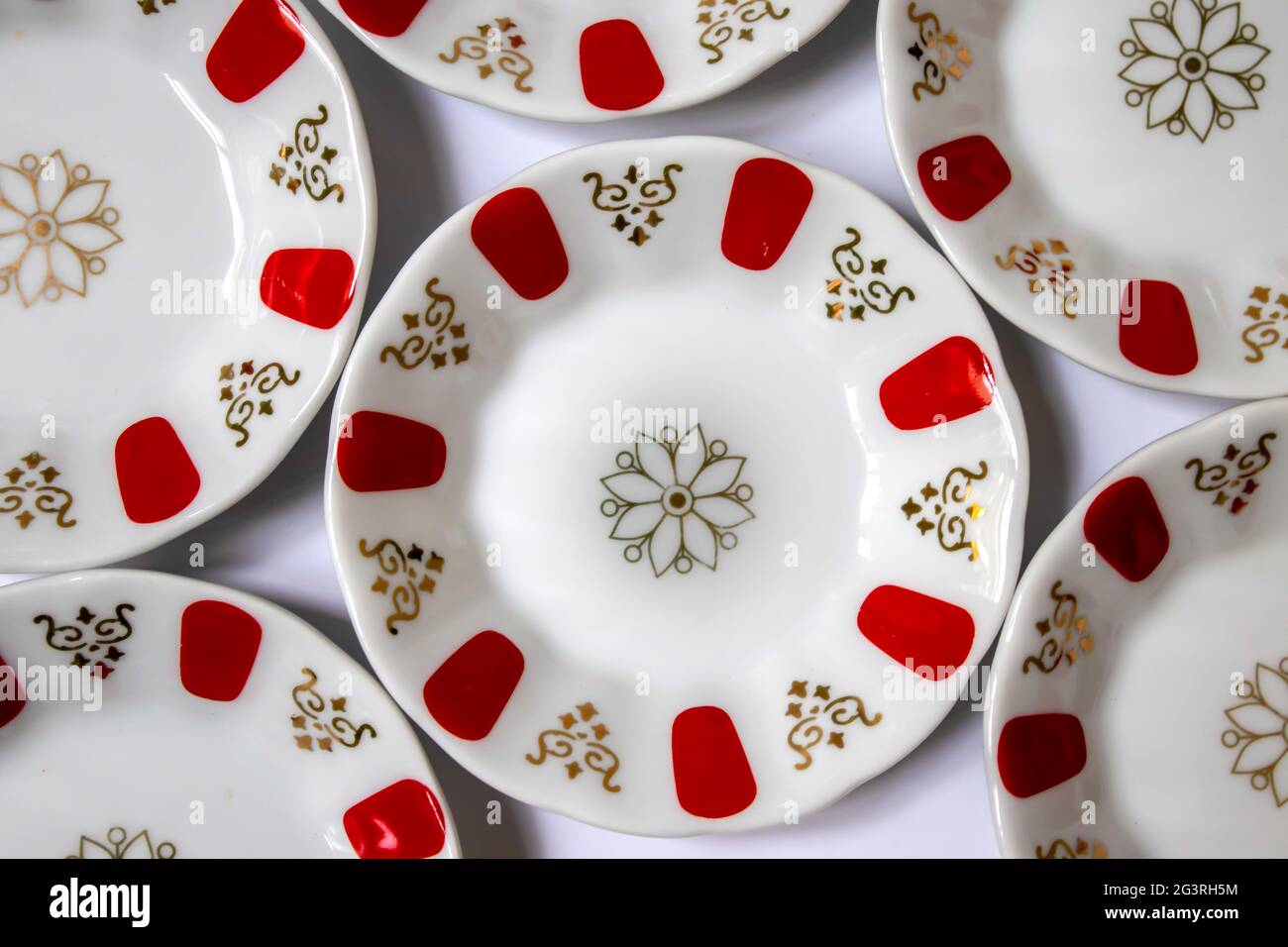 Close-up tea plate on white background. A must for tea glasses; Persian ...