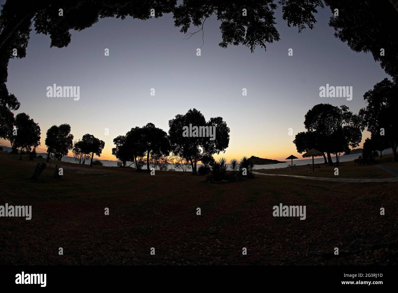 The light is fading as sunset approaches over the tropical resort on ...