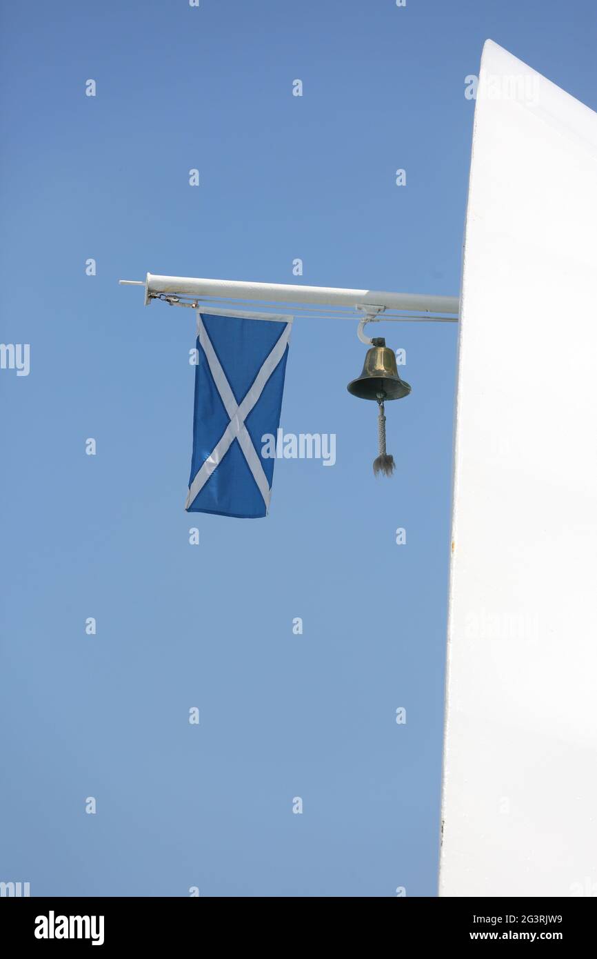 Saltire & flag against white background with a ships bell Stock Photo ...