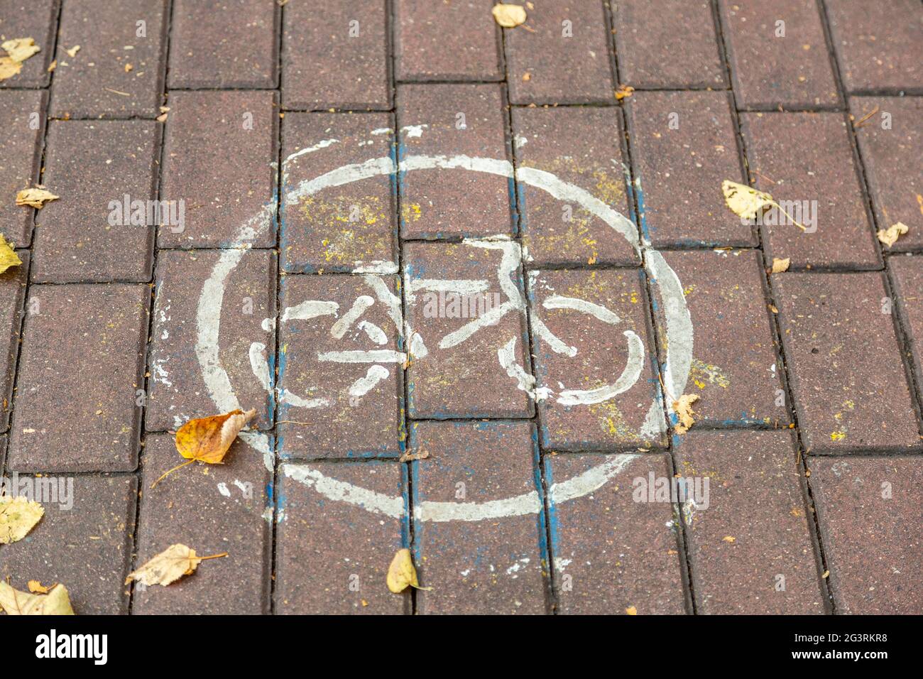 Bicycle traffic sign on stone sidewalk Stock Photo - Alamy