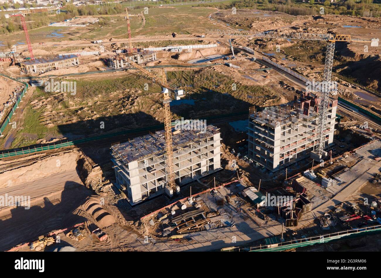Tower cranes in action at construction site. Crane during formworks ...
