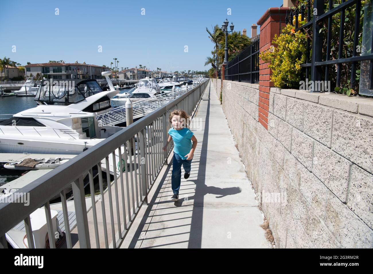 Being active. Active kid run on promenade. Energetic boy enjoy running ...