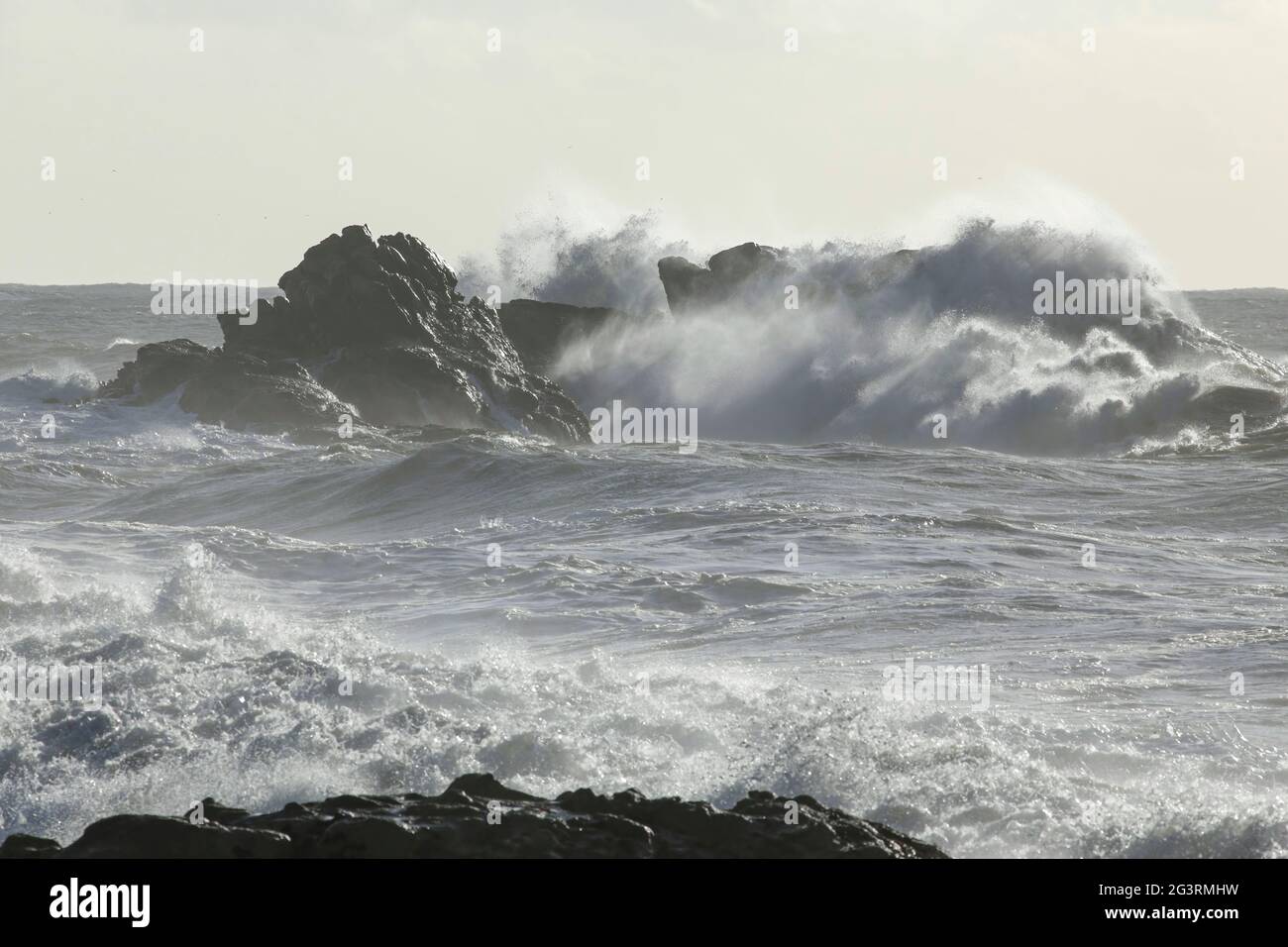 Powerful waves crash over rocks hi-res stock photography and images - Alamy