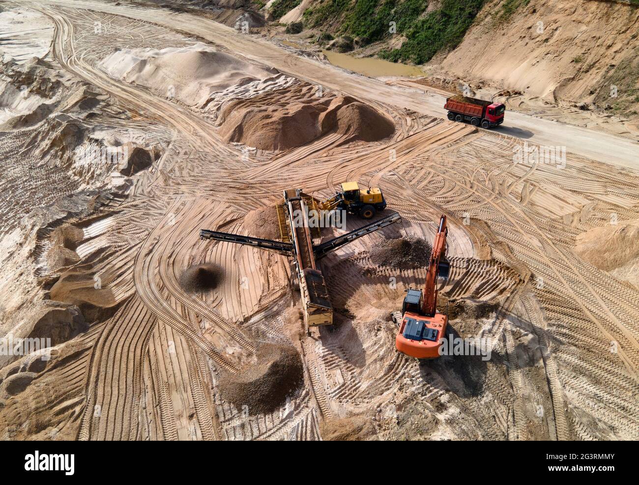 Arial view of the sand open-pit mining with heavy mining machinery ...